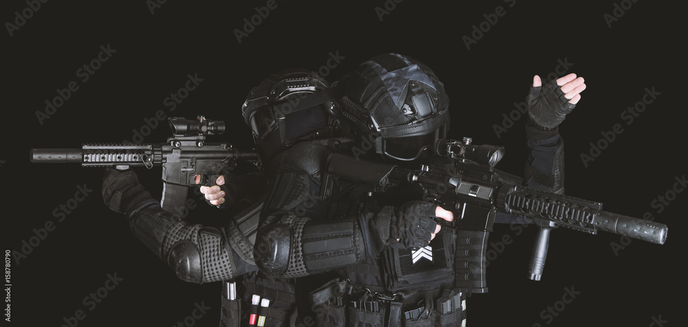 Members of the SWAT squad with an assault rifle in a black uniform on ...