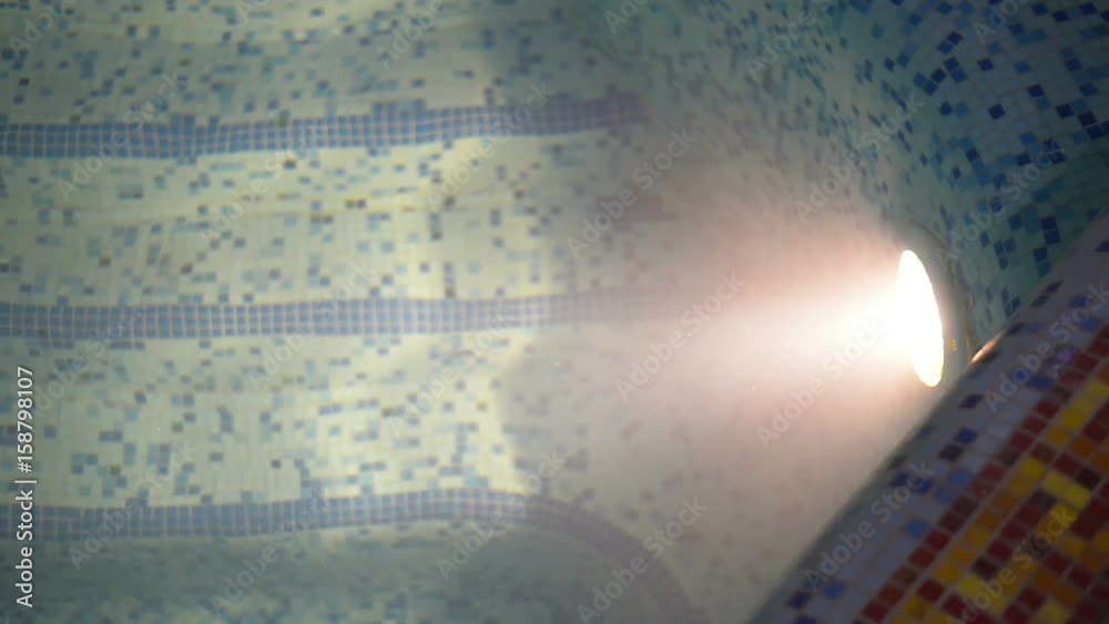 Water lighting in pool night. Underwater water lighting in swimming ...