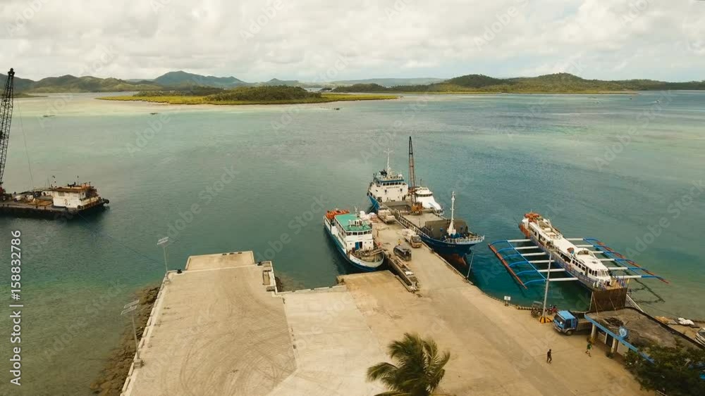 Vidéo Stock Cargo and passenger port with barges and cargo ships on ...
