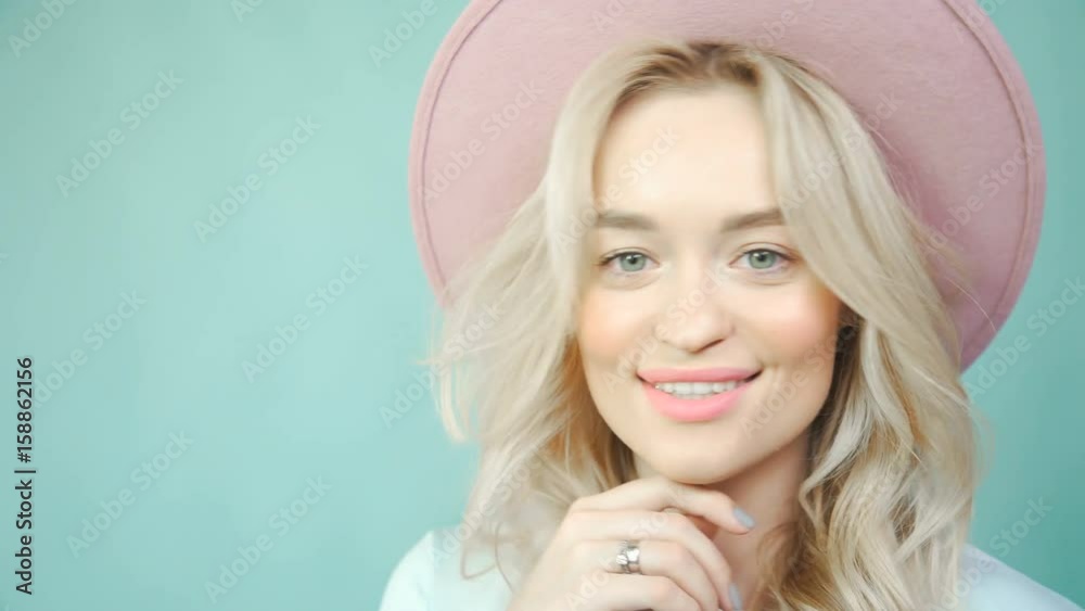 Young beautiful woman on isolated background. Photogenic young blonde ...