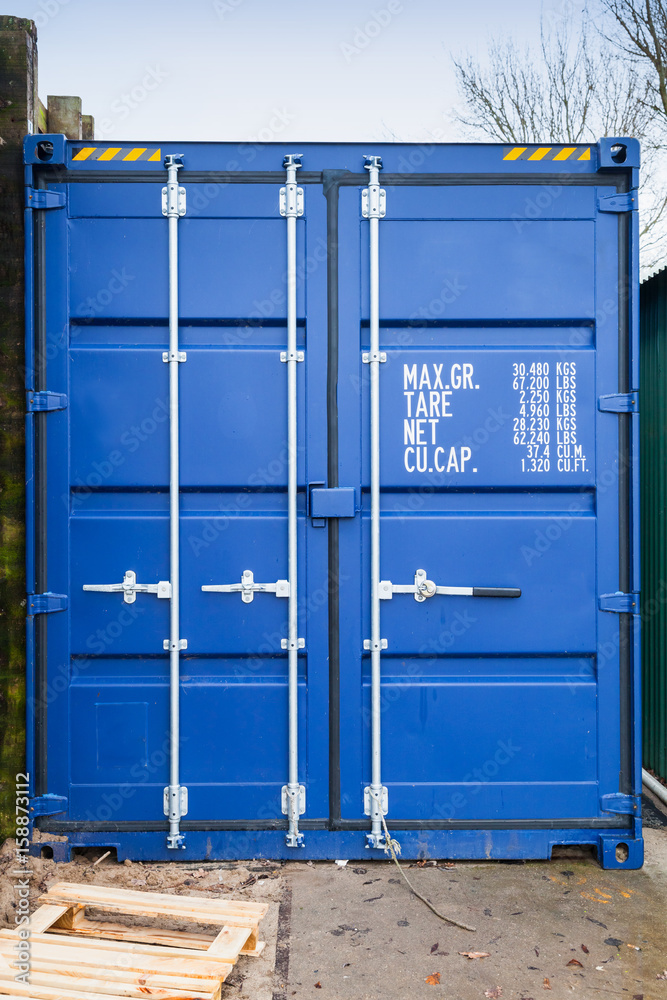 Closed blue shipping cargo container, gate side Stock Photo | Adobe Stock