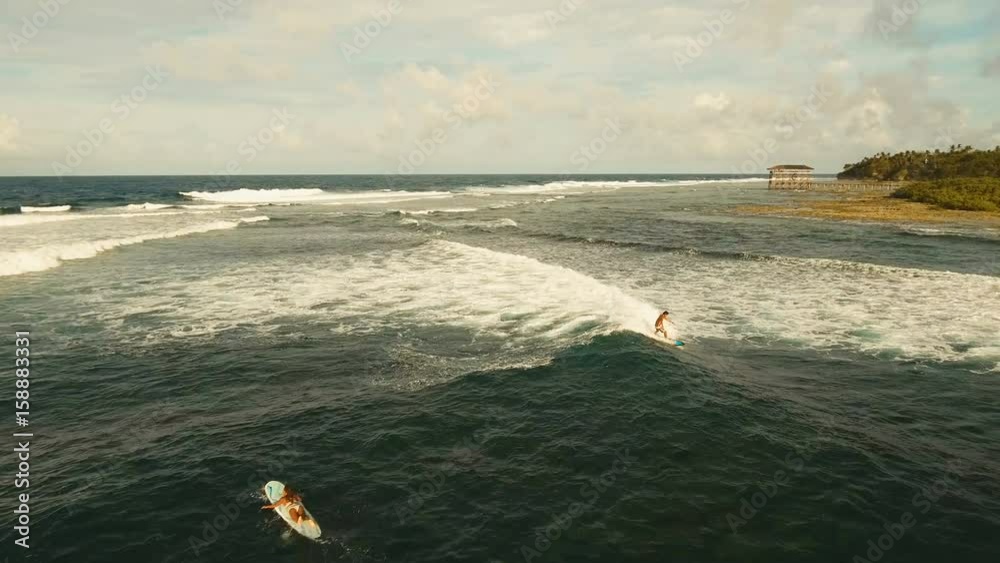 Surfers at siargao islands famous surf break cloud 9 near mindanao the ...