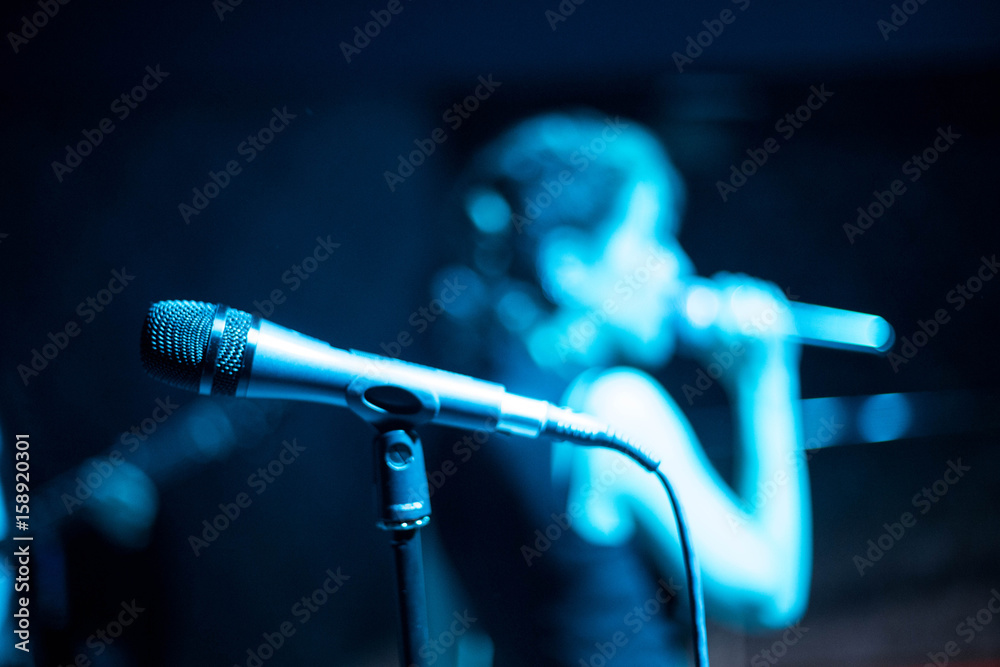 Microphone Stands On Stage In A Nightclub Bright Club Light Shines On