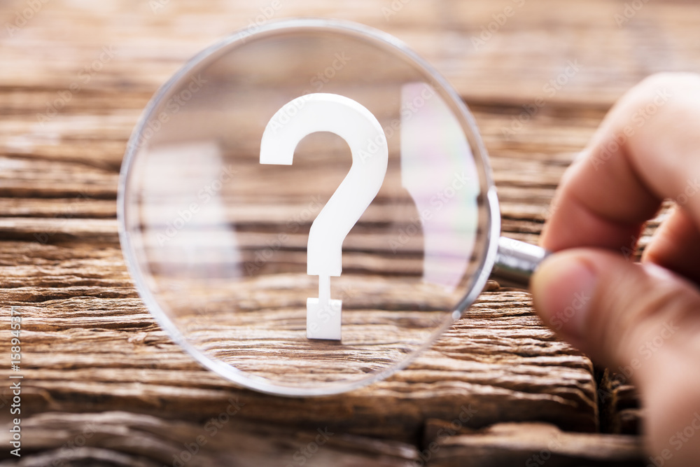 Question Mark Sign Through Magnifying Glass Stock Photo | Adobe Stock