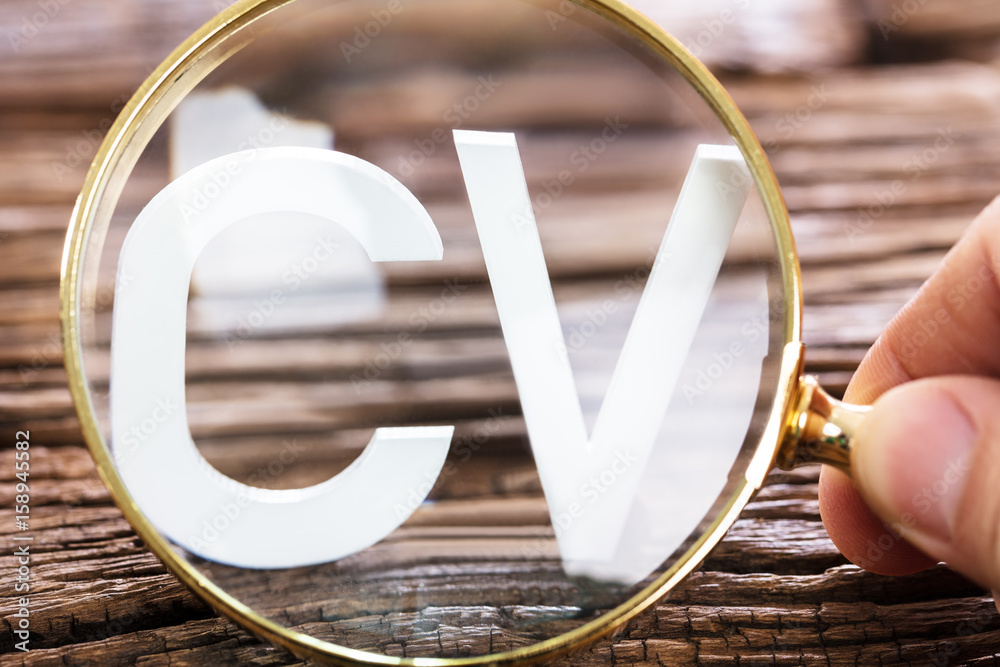 CV Word Through Magnifying Glass Stock Photo | Adobe Stock