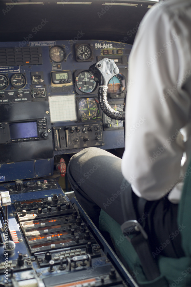 Pilot hands and airplane control panel in flight Stock Photo | Adobe Stock