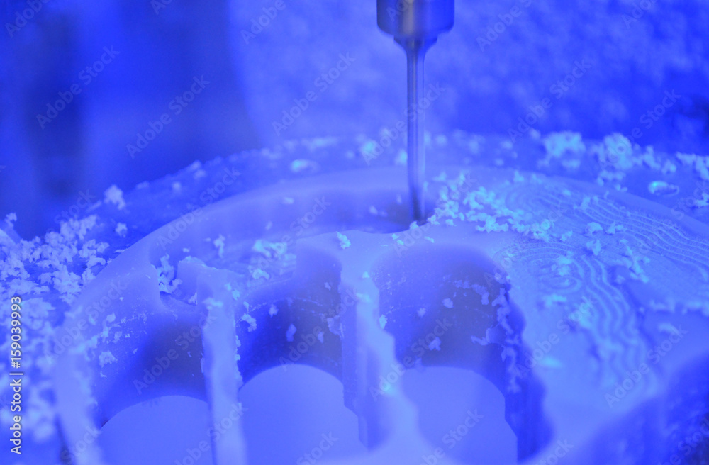 Dental milling machine carving out shape of human teeth Stock Photo ...