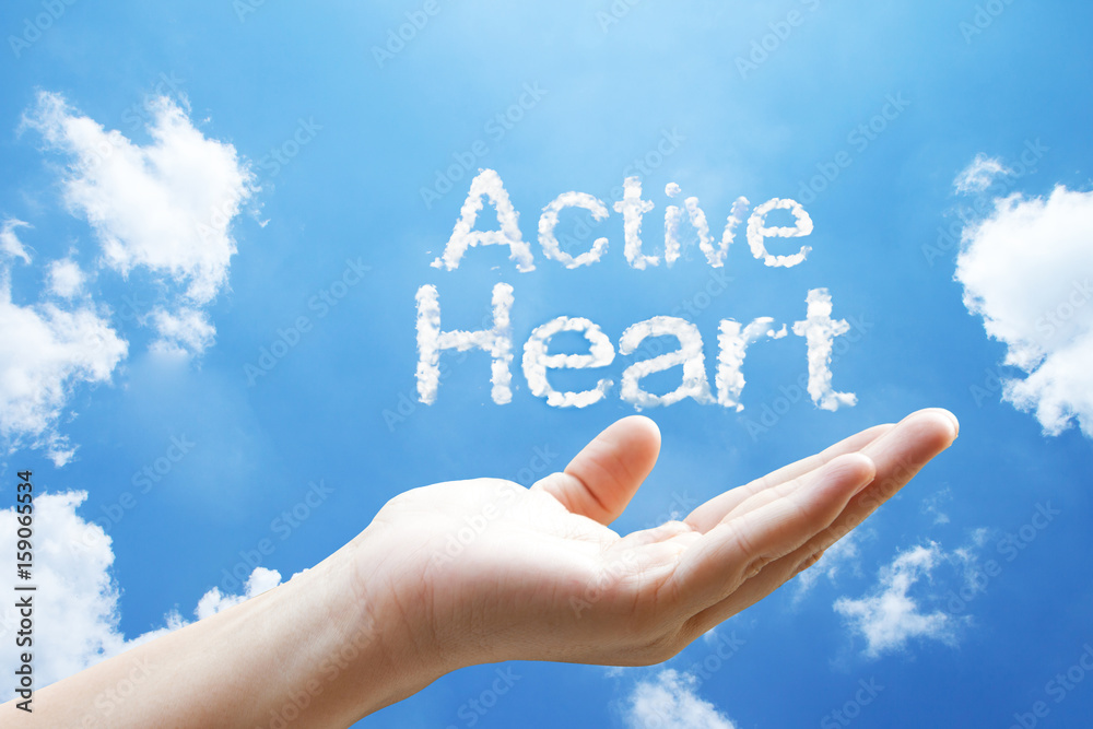 “Active Heart” cloud word floating on upturned hands.. Stock Photo ...