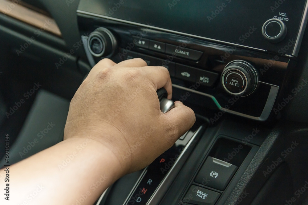 hand on automatic gear shift, Man hand shifting an automatic car ...