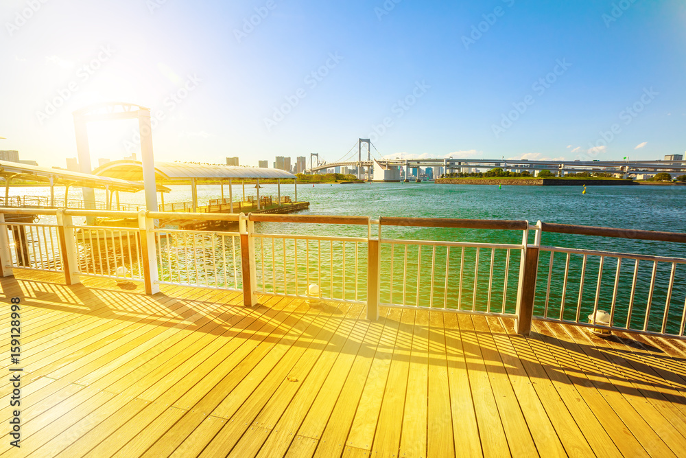 Sunset promenade walkway and jetty where waterbuses and ferry boats ...