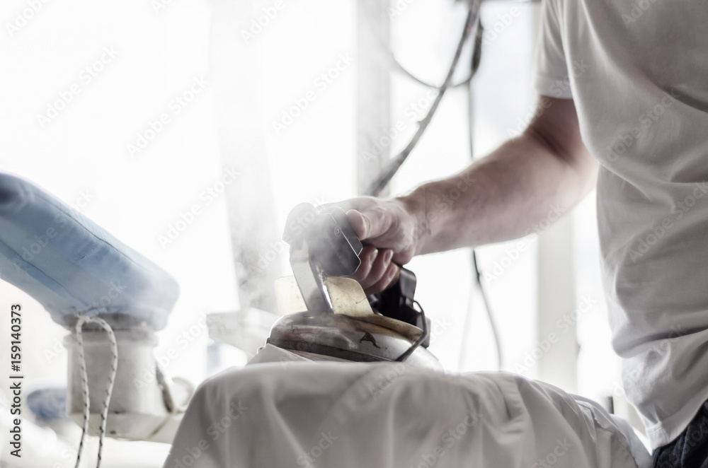hand ironing Stock Photo | Adobe Stock