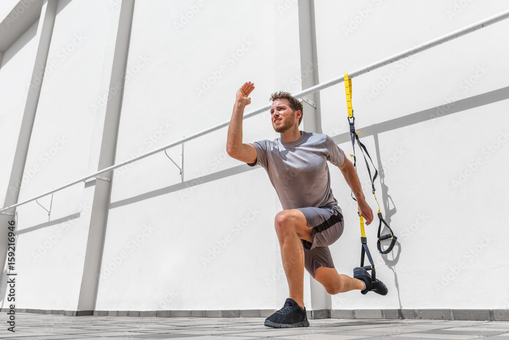 Fitness suspension straps man training legs with suspended lunge ...