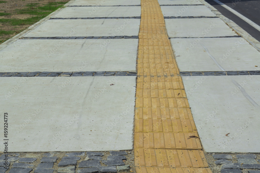 Foto de tactile paving for blind handicap on tiles pathway, walkway for ...