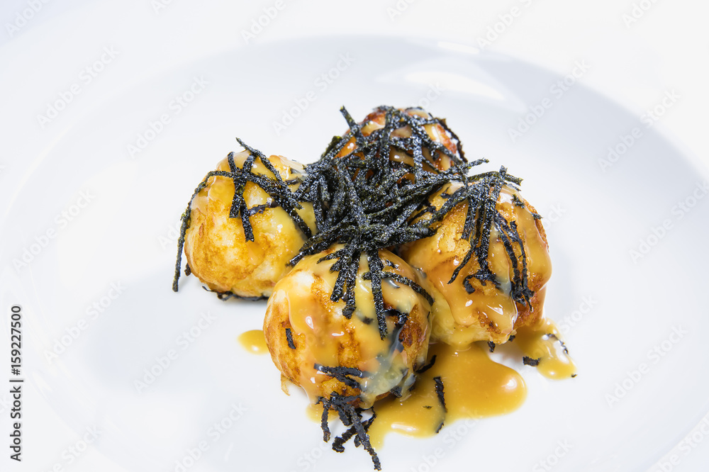 Appetizer Japanese food, "Takoyaki" with white background. topping with ...