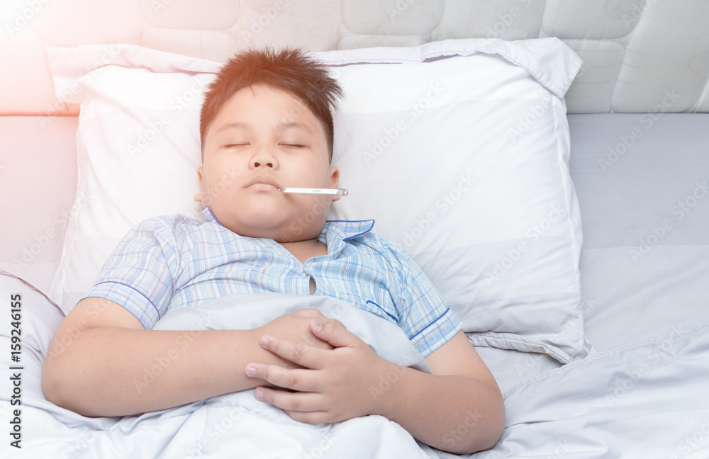 Sick obesity boy sleep with thermometer Stock Photo | Adobe Stock