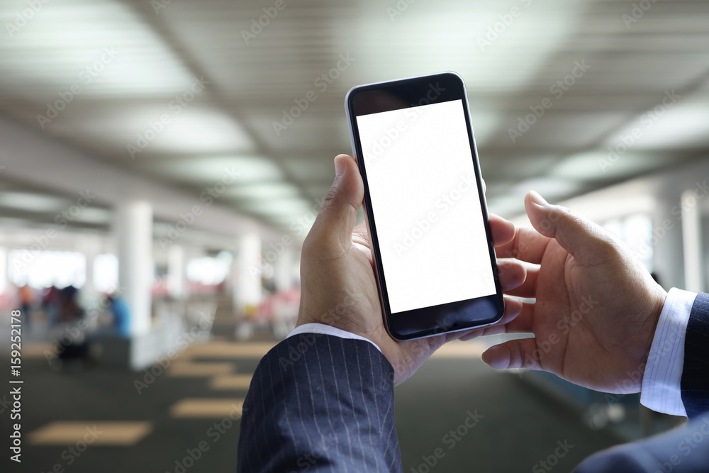 business man hands hold mobile blank screen of smart phone at airport ...