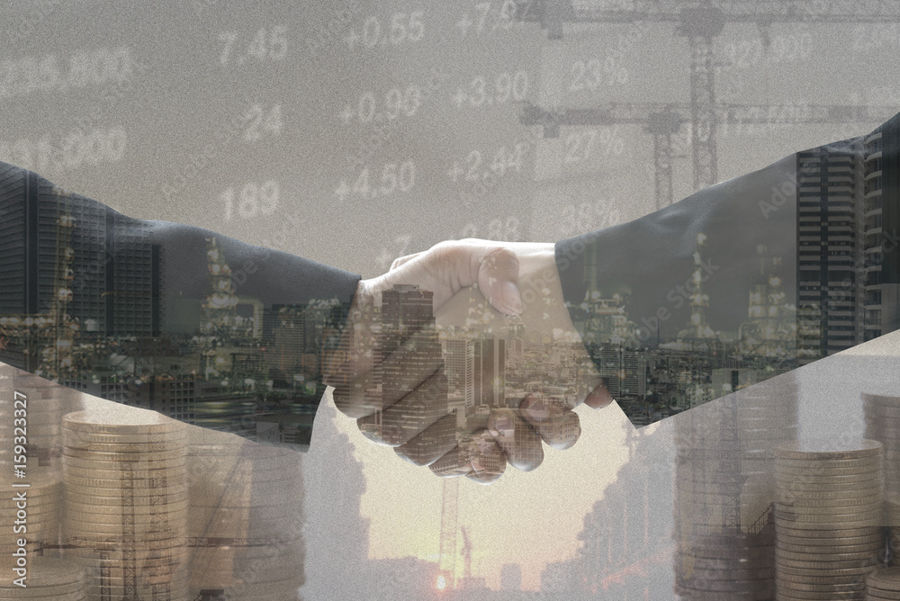 Double exposure business worker with graph finance and factory ...