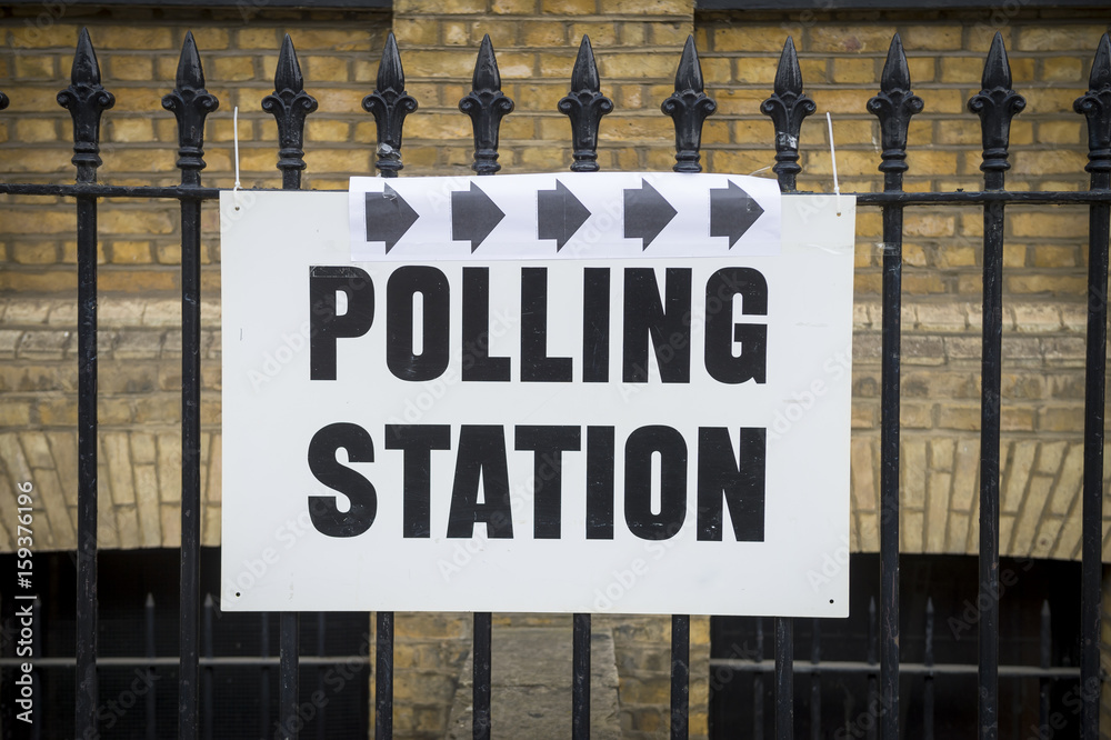 British election polling station sign hanging on classic wrought iron ...