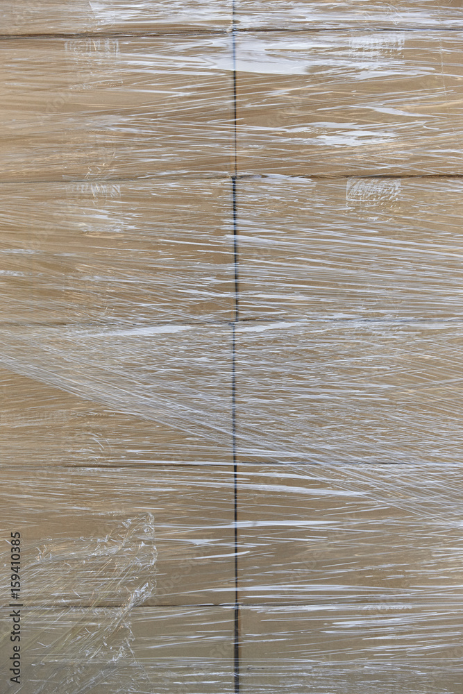 Shrink wrapping on a stacked cardboard boxes. Delivery Stock Photo ... Shrink wrapping on a stacked cardboard boxes. Delivery Stock Photo ...