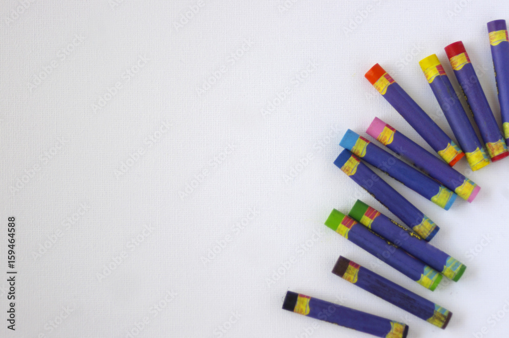 Rainbow colored oil pastels scattered on white background Stock Photo ...