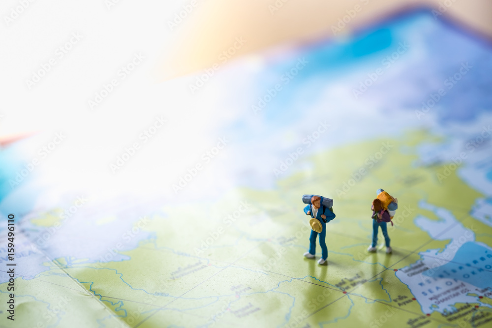Travel concepts. Two traveler male and female miniature mini figures ...