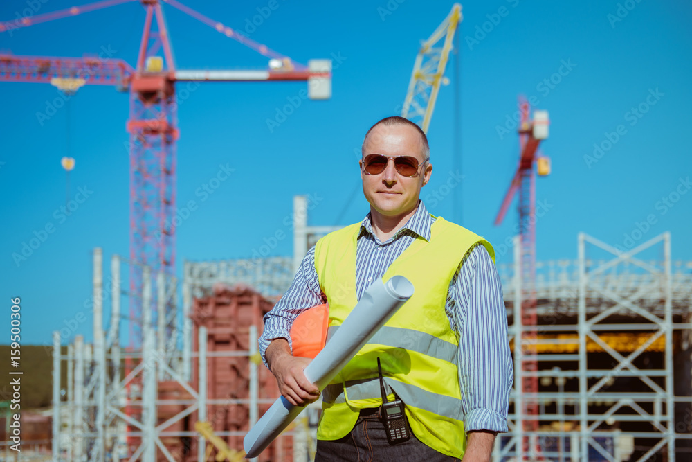 Portrait of a male engineer on a construction site background Stock ...