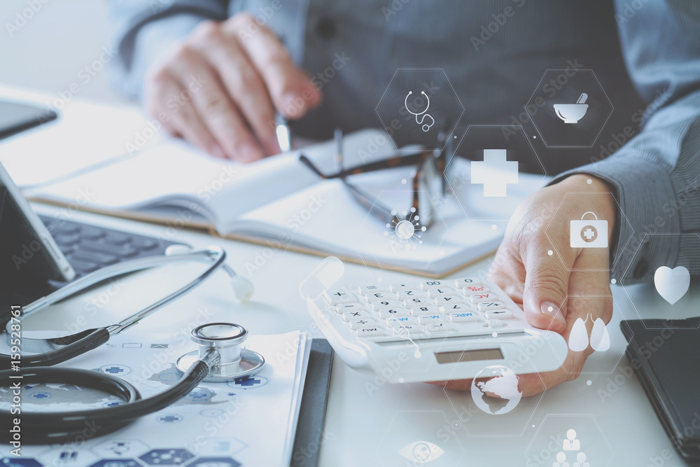 Healthcare costs and fees concept.Hand of smart doctor used a ...