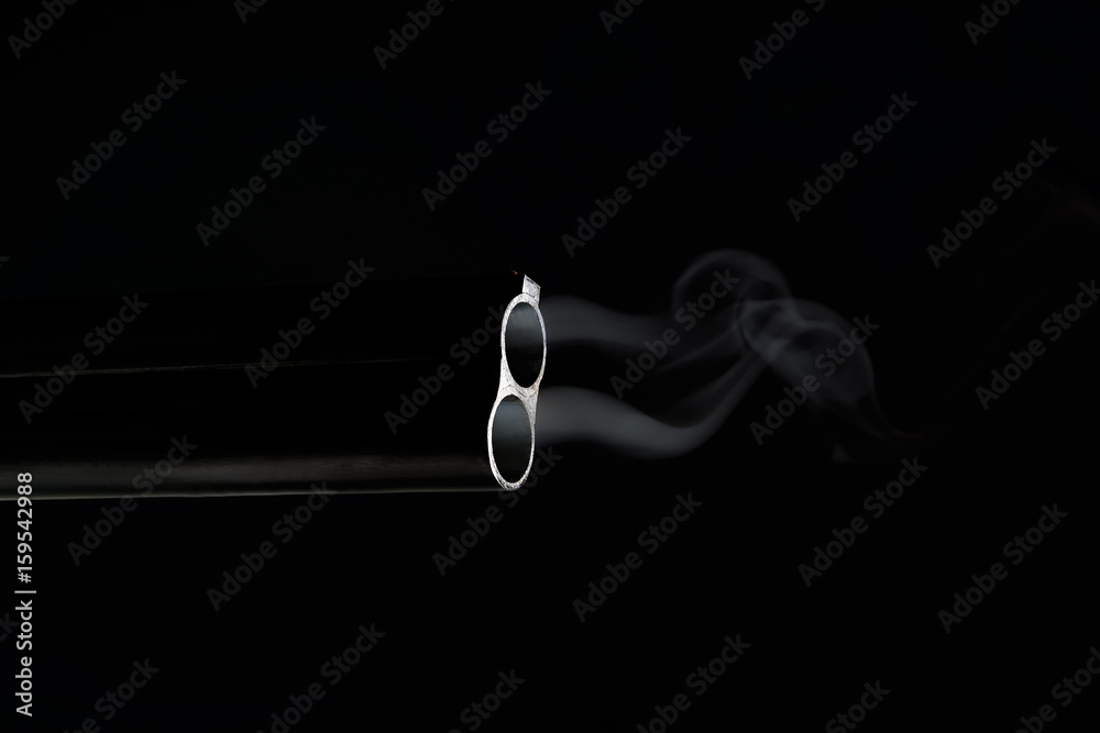 Smoke from a barrel from a gun on a black background Stock Photo ...