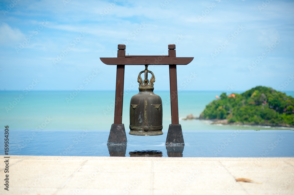 The bell located in an infinity edge pool with the sea view Stock Photo ...