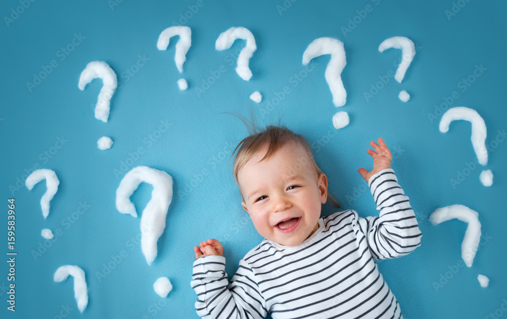 little boy with lots of question marks Stock Photo | Adobe Stock