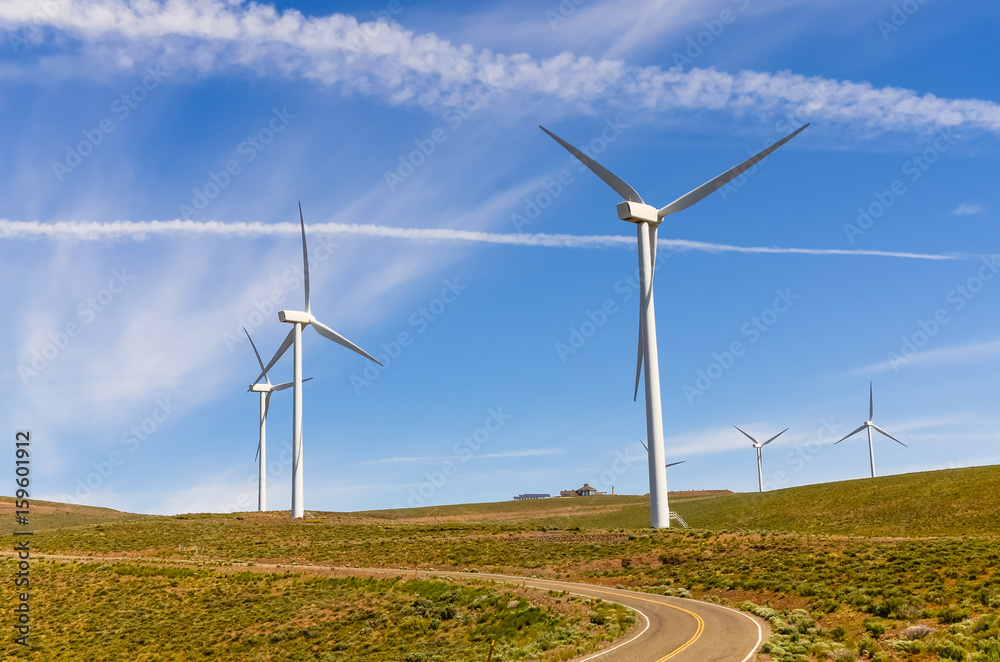 Entrance of a wind farm with the asphalt road leads to horizontal and ...