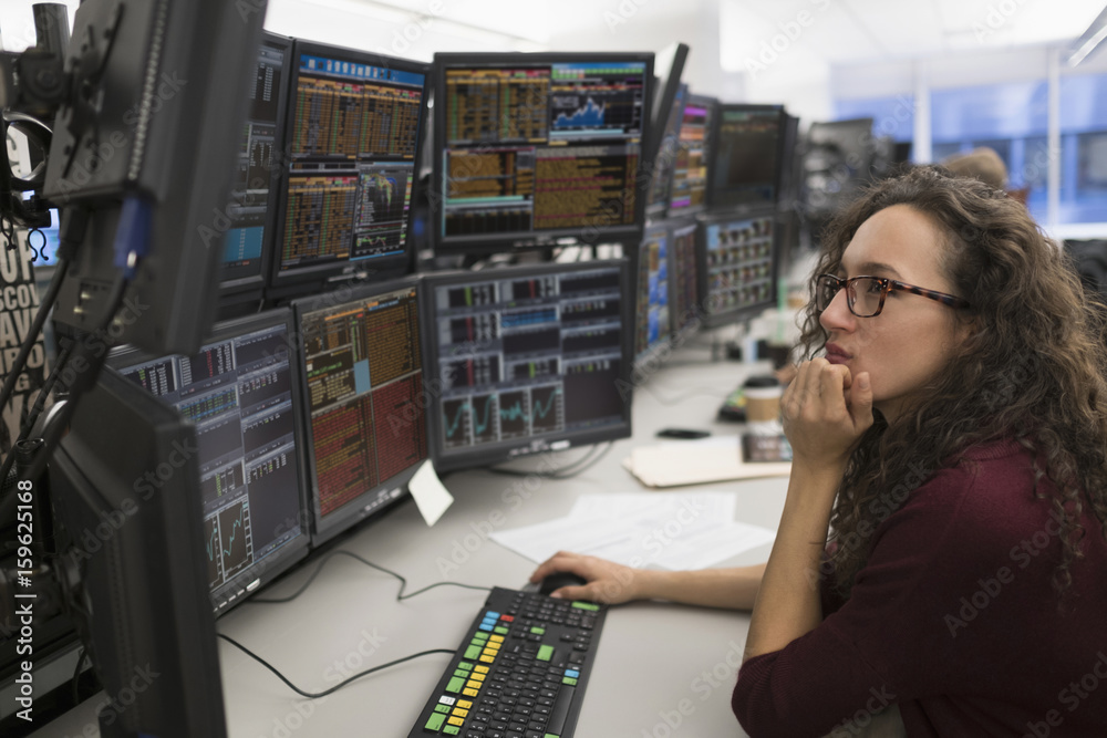 Young woman analyzing computer data Stock Photo | Adobe Stock