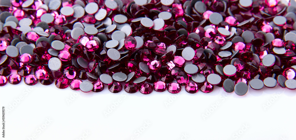 Precious sparkling rhinestones rose colors on a white background. Stock ...