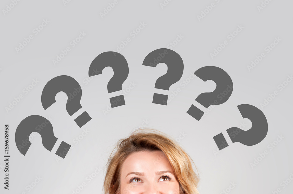 Thinking women with question marks above her head Stock Photo | Adobe Stock