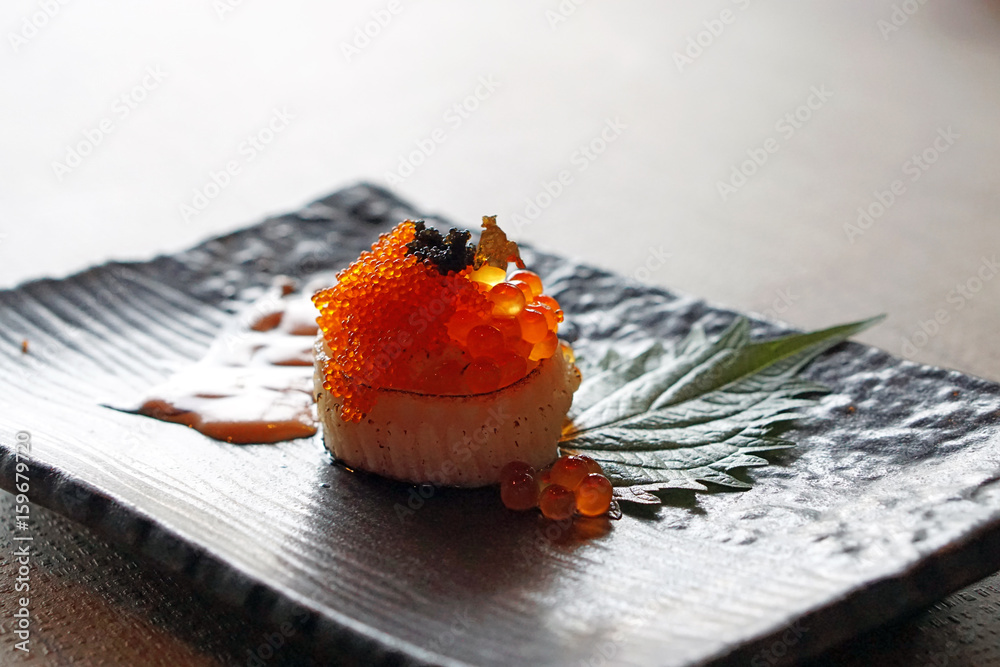 Engawa Sushi Roll topped with Tobiko (Flying fish caviar) and Ikura ...