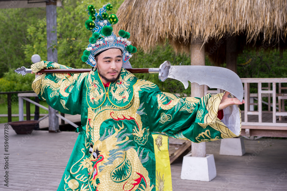 chinese man in traditional costume with sword outdoor Stock Photo ...
