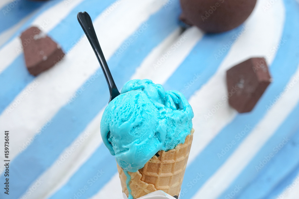 Blue Ice cream. scoop of blue ice cream, melting ice cream and plastic ...