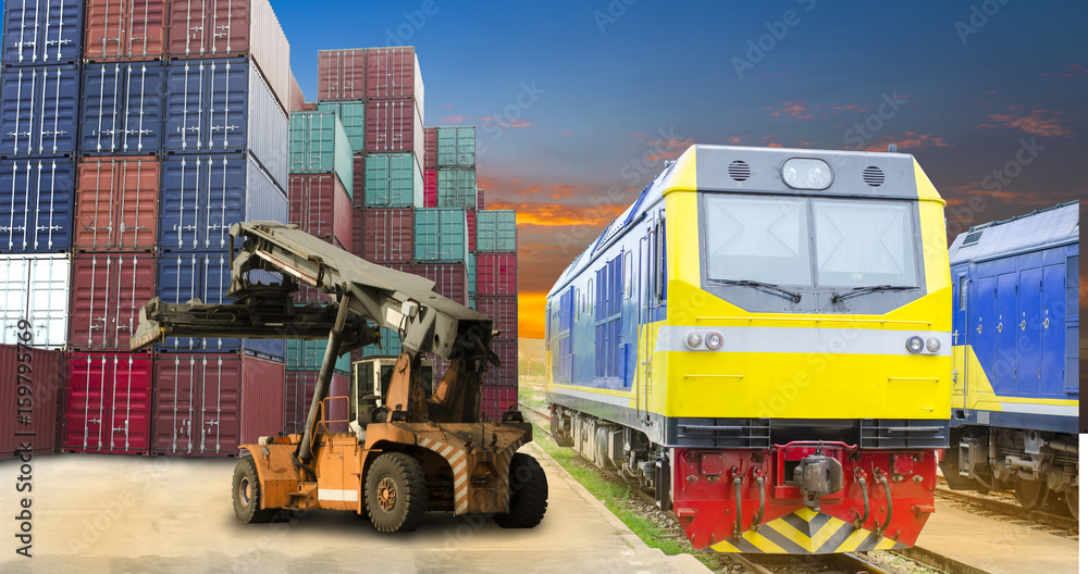 train ,stacker and container box in sunset sky with sun ray or orange ...