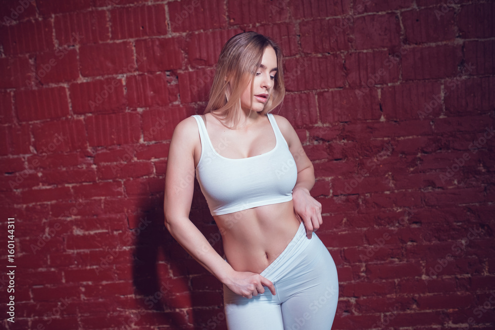 Sexy Blonde Woman With Huge Breast In A White Top And Leggings Mock Up