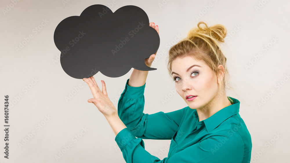 Woman holding black thinking bubble Stock Photo | Adobe Stock