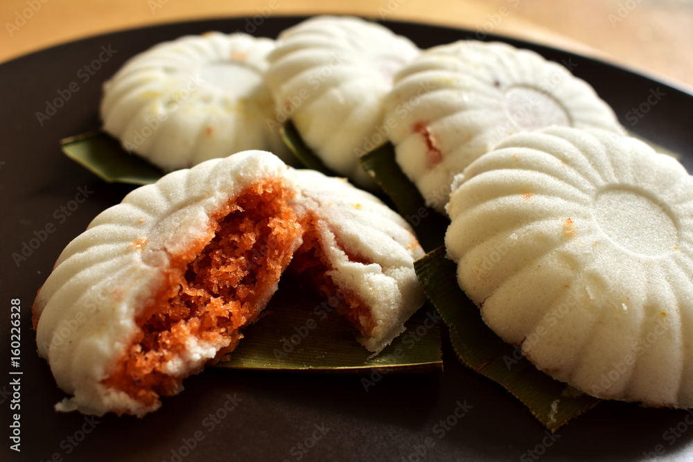 Traditional Singapore street food: kueh tutu, steamed rice flour with ...