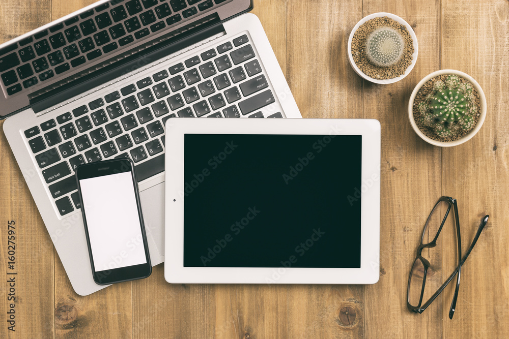 Top view of tablet isolated black screen and smartphones white screen ...