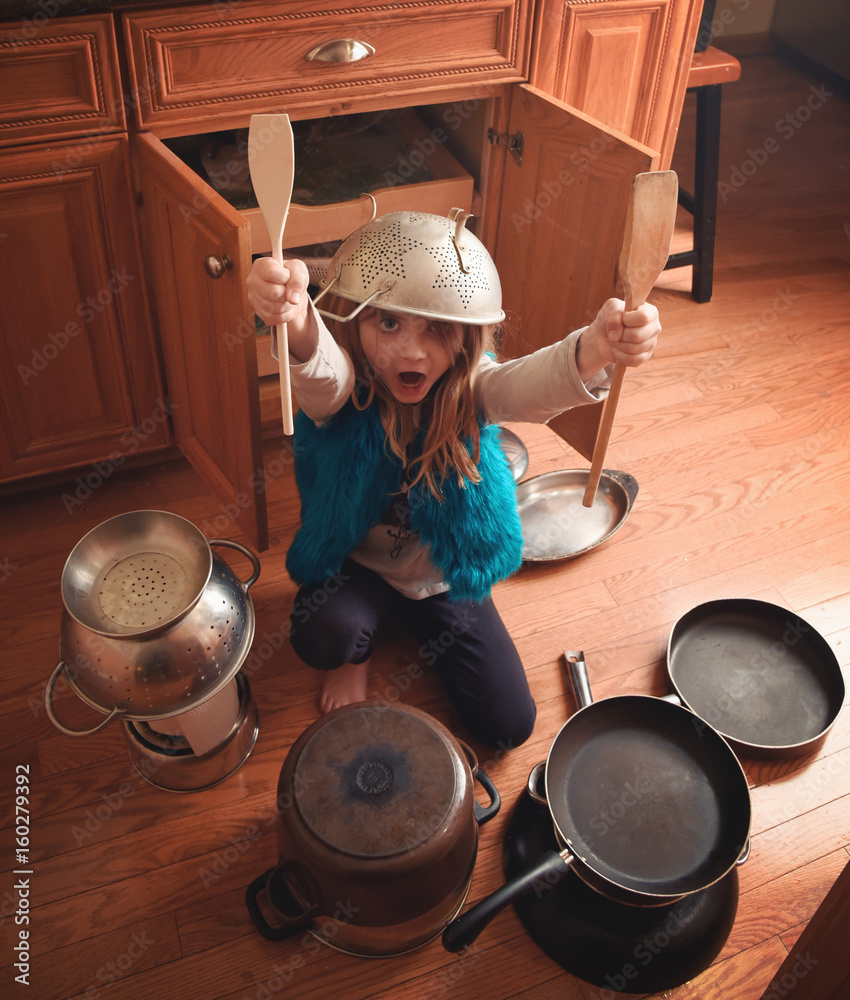 Creative Child Playing Music with Pots and Pans Stock-Foto | Adobe Stock