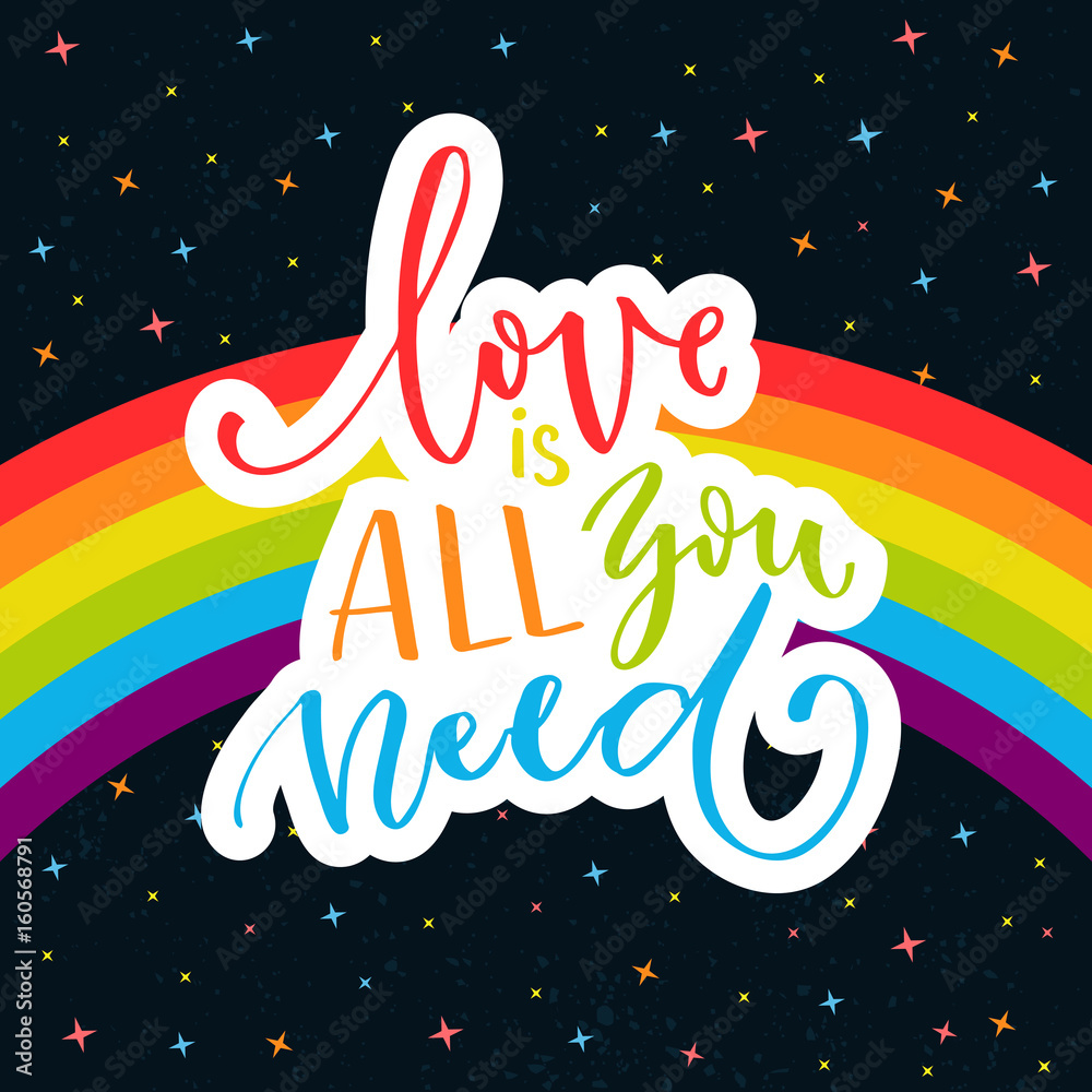 Love is all you need. Romantic quote on rainbow parade flag at dark sky ...