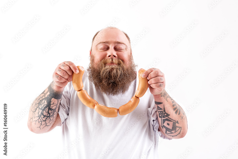 Man holding sausage Stock Photo | Adobe Stock