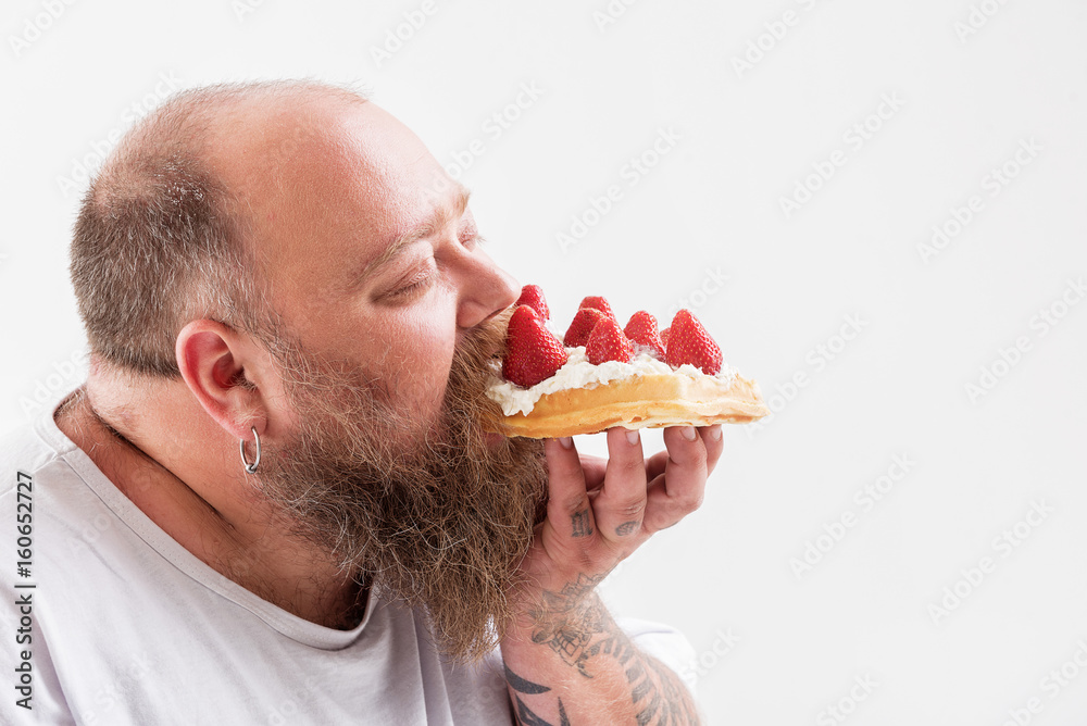 Man eating cake Stock Photo | Adobe Stock