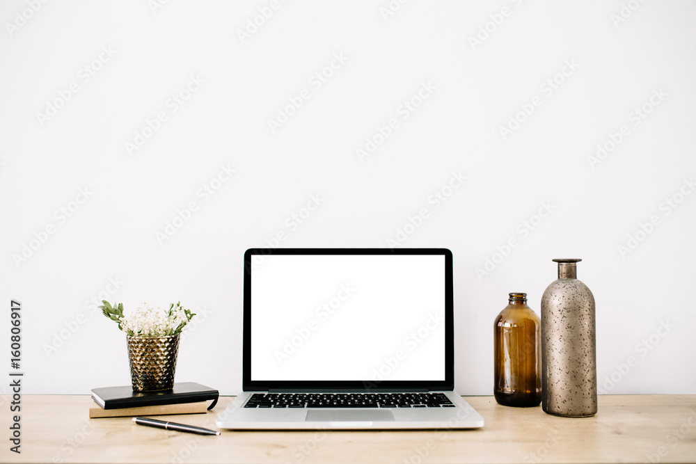Blogger or freelancer workspace with front view of laptop with blank ...