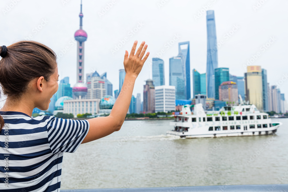 Woman waving goodbye at cruise ship leaving Shanghai city - Travel ...