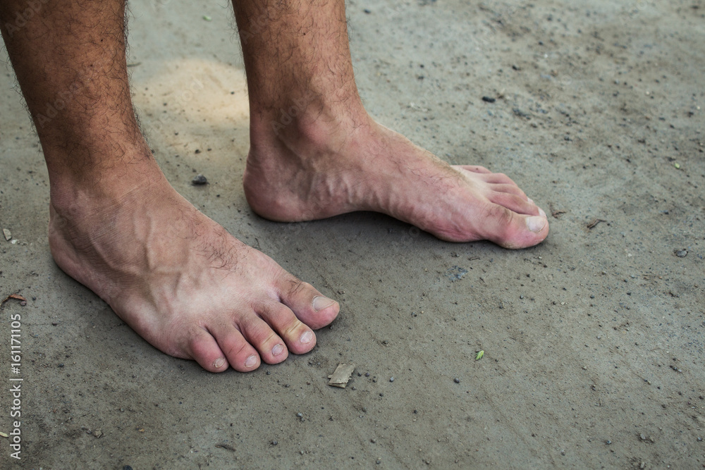 feet of a man on the ground Stock Photo | Adobe Stock