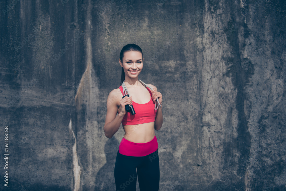 Great job! Happy young sport woman in stylish training outfit with ...